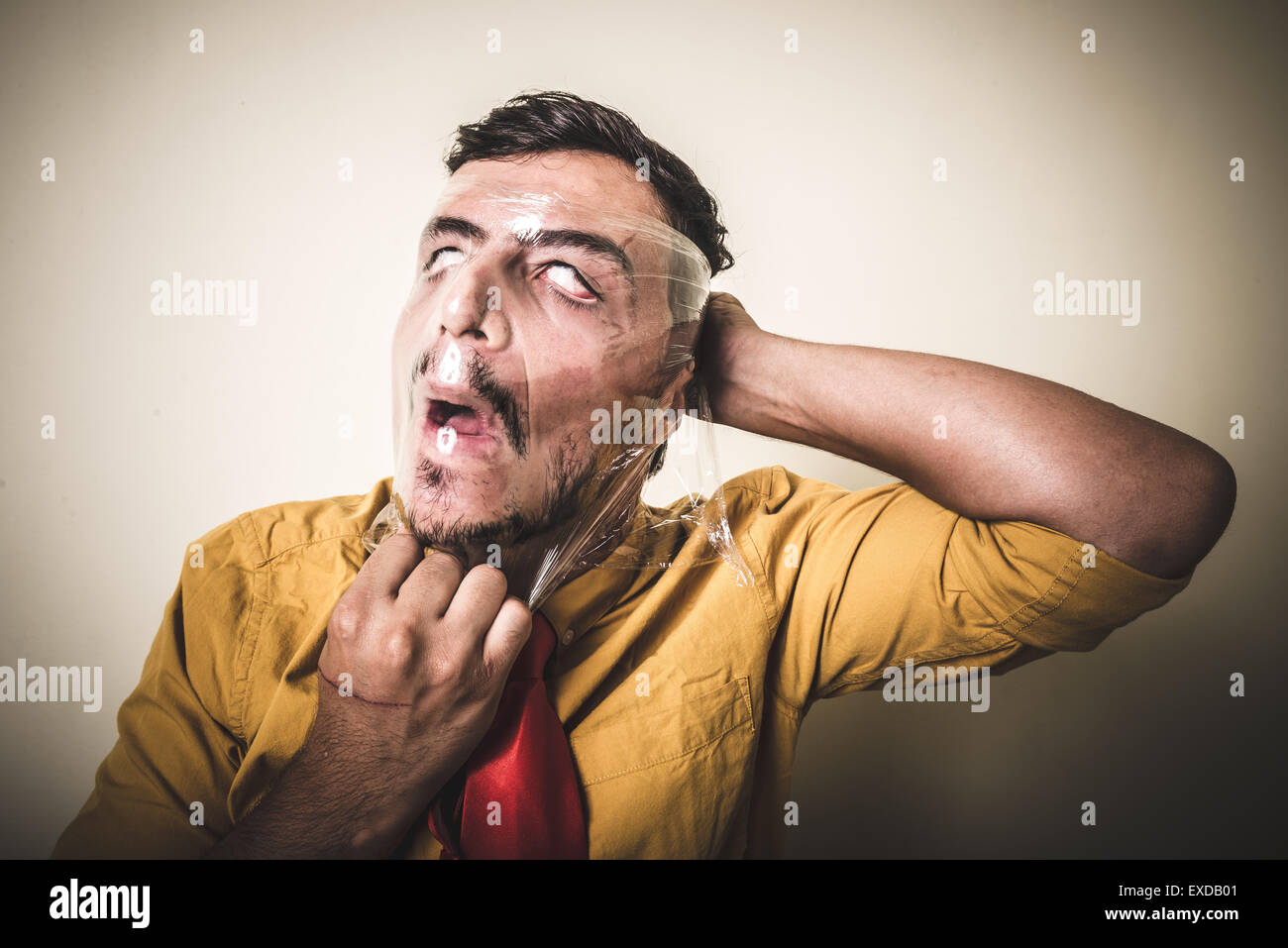 suffocating man with the plastic on white background Stock Photo - Alamy