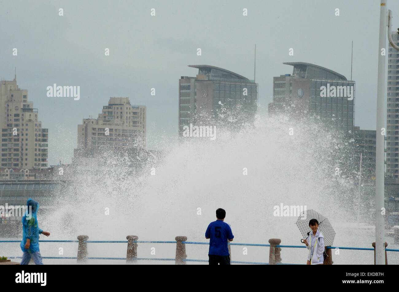 Qingdao, China's Shandong Province. 12th July, 2015. People watch huge ...