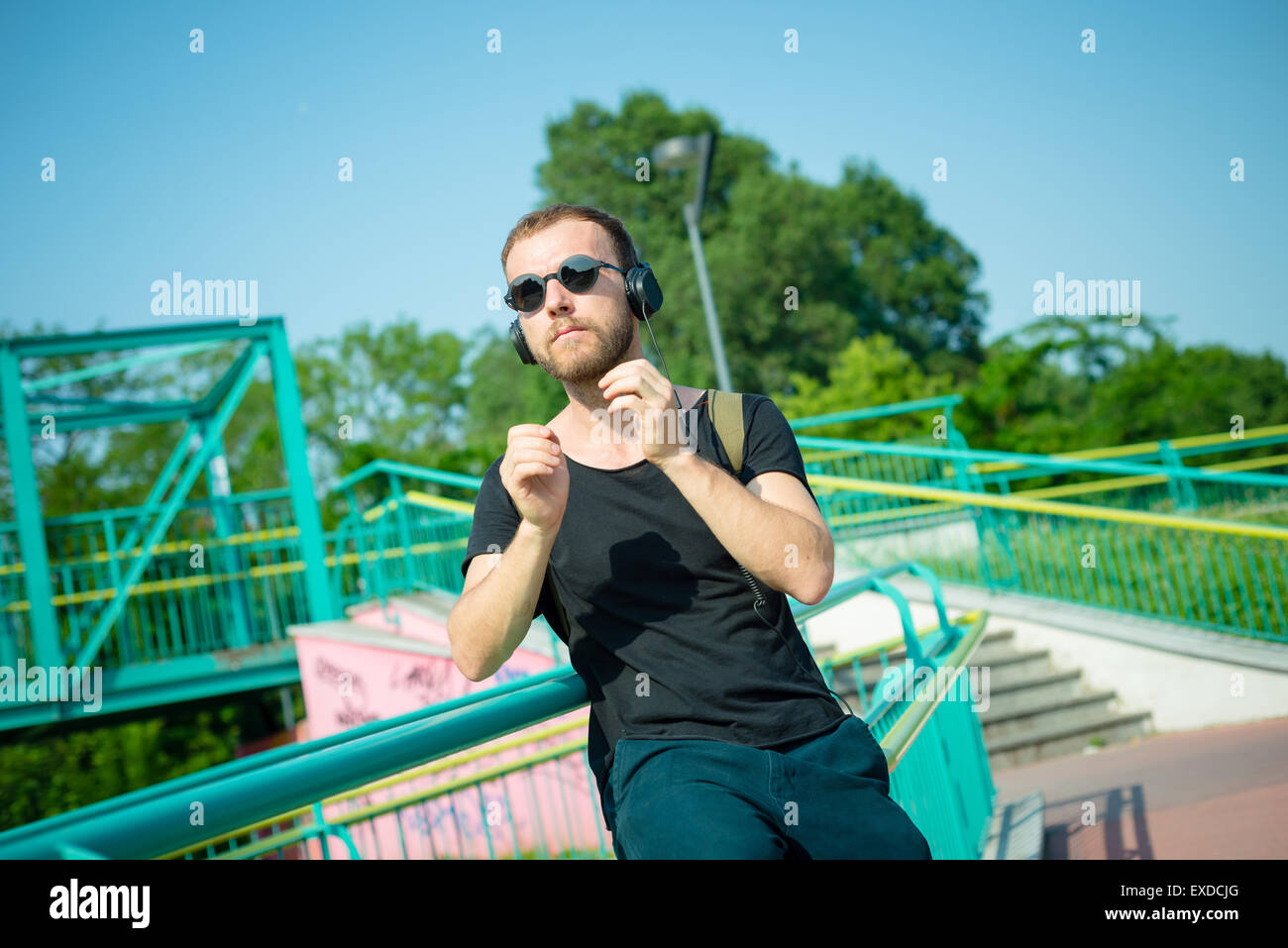 hipster modern stylish blonde man listening music in daily life Stock ...