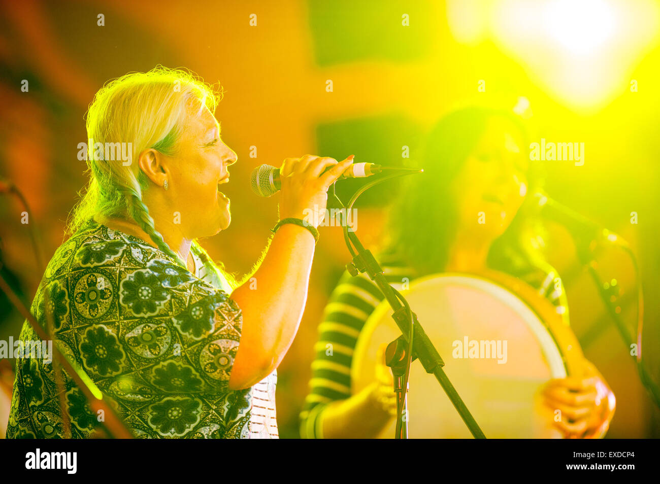 Great Tew, Oxford, UK. 12th July 2015. The Fishwives' Choir performs on ...