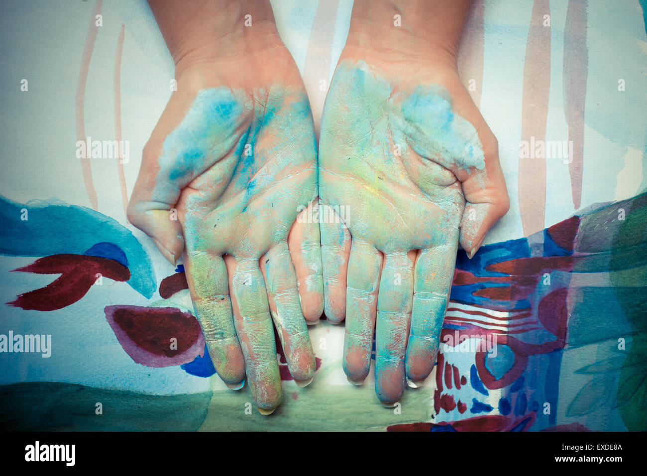 colorful painted hands on colored background Stock Photo - Alamy