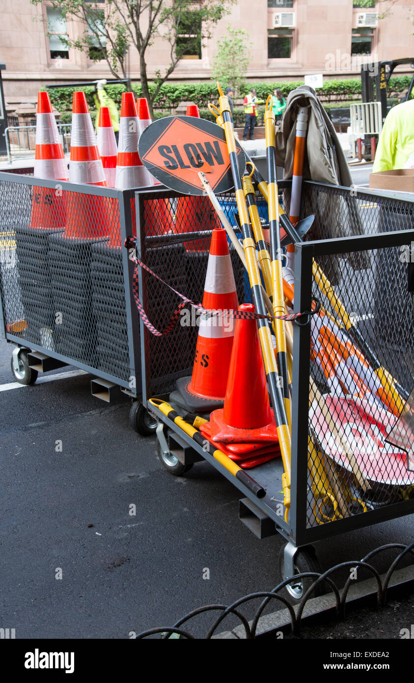Roadside storage of cones with stop and slow sign boards in wire ...