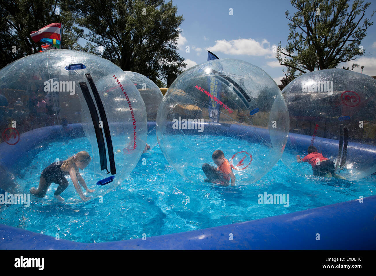 Children have fun in floating large water balls at the Biggin Hill ...