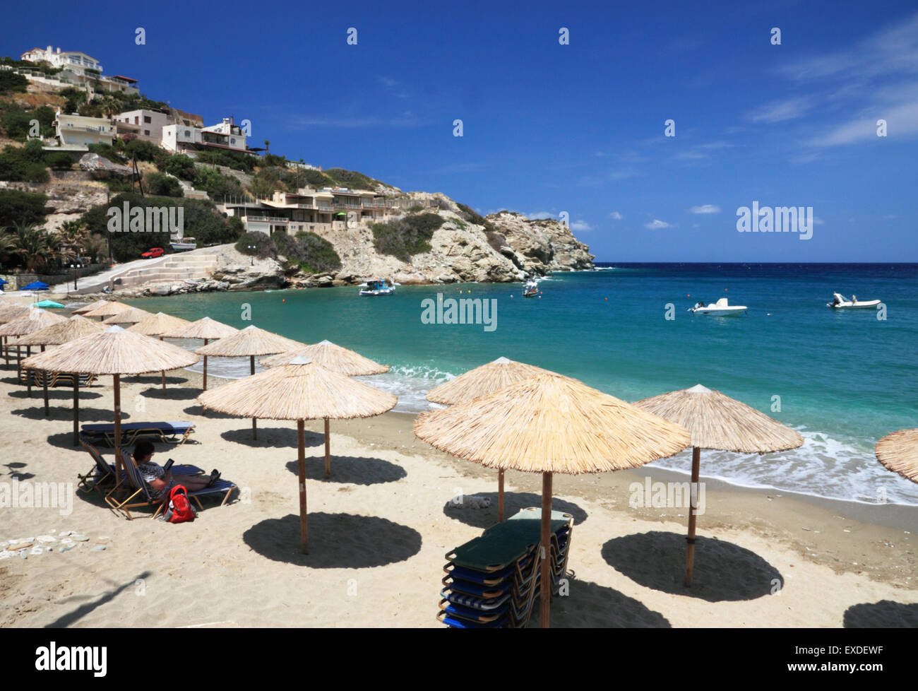 A Mediterranean cove with turquoise blue sea, rocky cliffs and ...