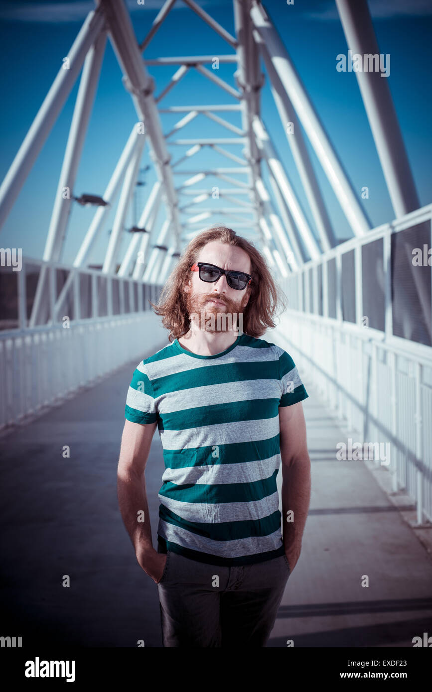 stylish hipster model with long red hair and beard lifestyle in the ...