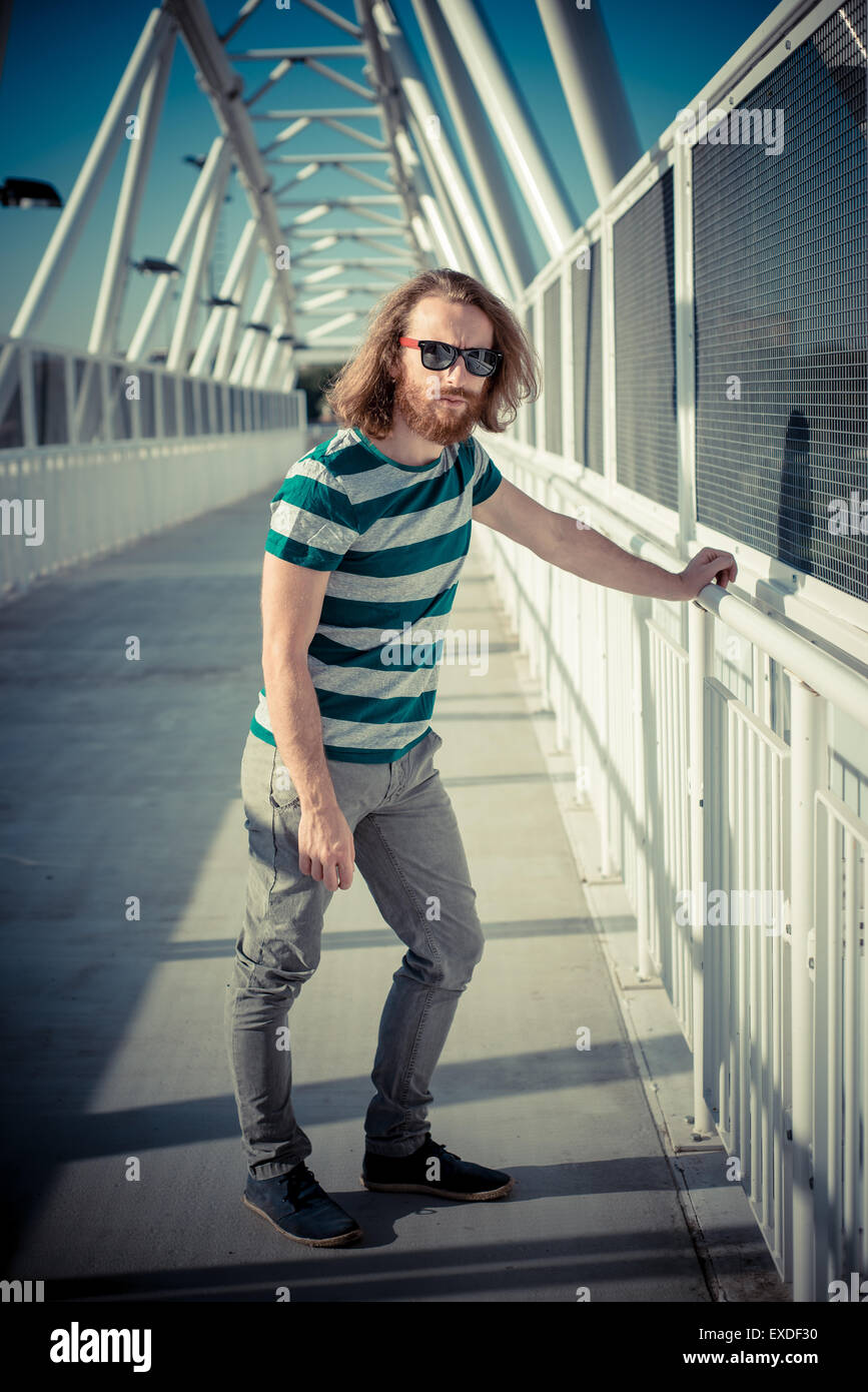 stylish hipster model with long red hair and beard lifestyle in the ...