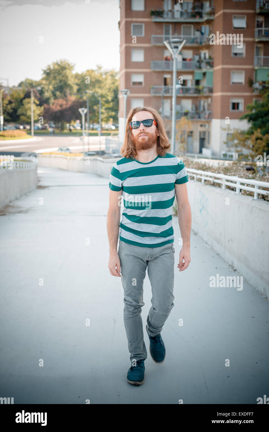 stylish hipster model with long red hair and beard lifestyle in the ...