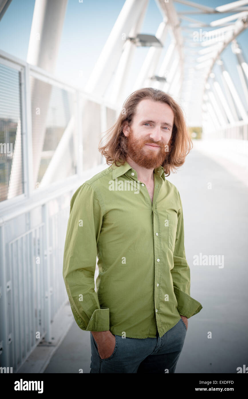 stylish hipster model with long red hair and beard lifestyle in the ...
