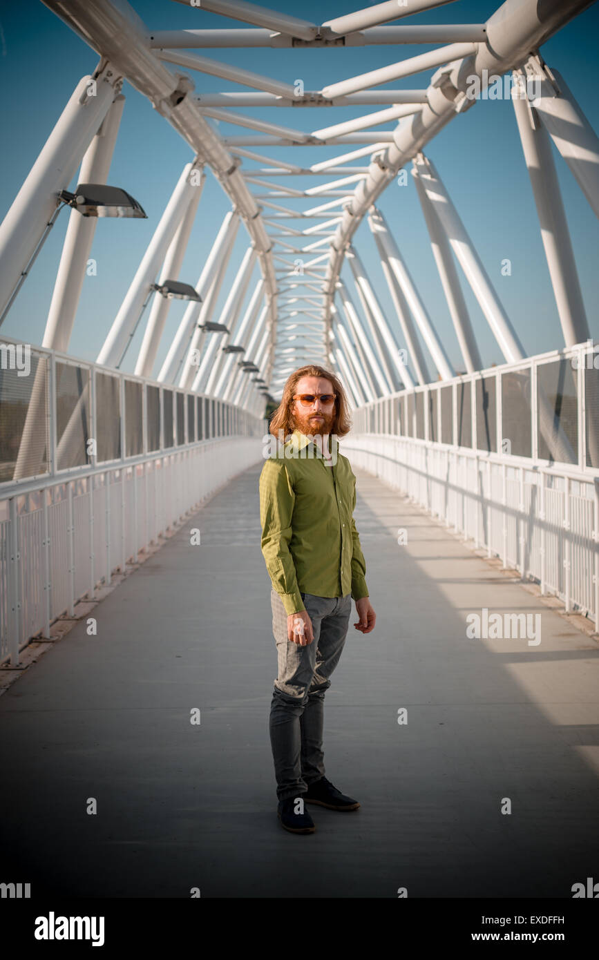 stylish hipster model with long red hair and beard lifestyle in the ...