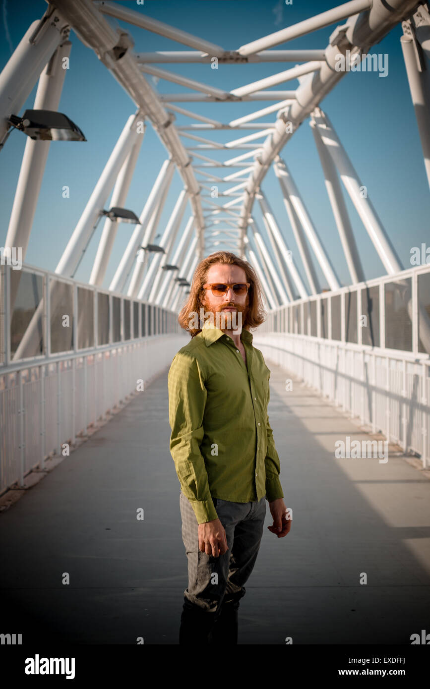 stylish hipster model with long red hair and beard lifestyle in the ...