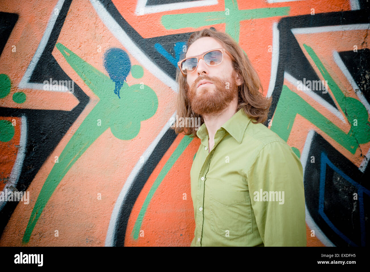 stylish hipster model with long red hair and beard lifestyle in the ...