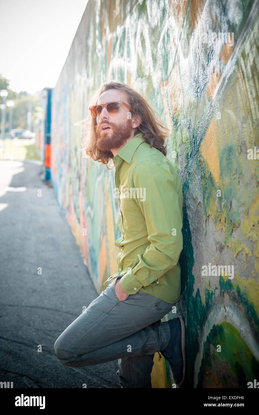 stylish hipster model with long red hair and beard lifestyle in the ...