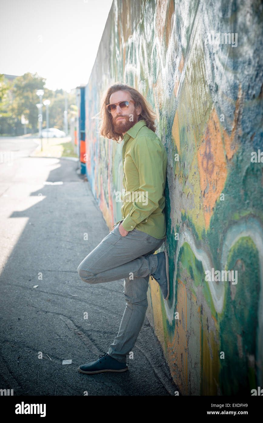 stylish hipster model with long red hair and beard lifestyle in the ...