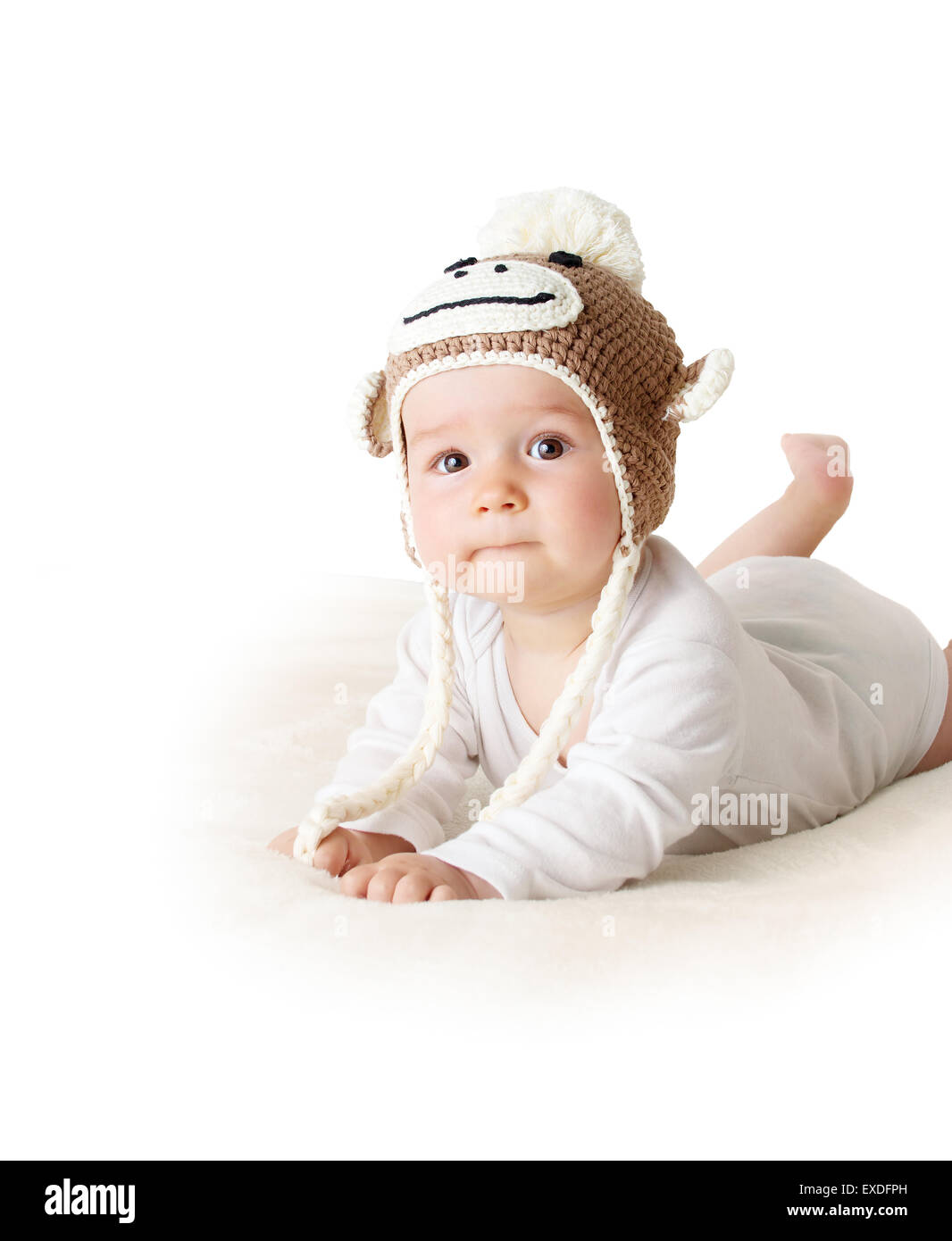 Baby in monkey hat Stock Photo - Alamy