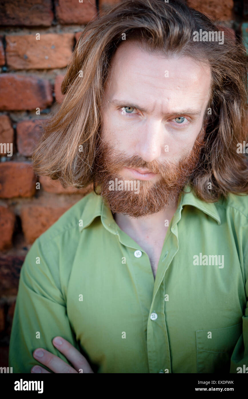 stylish hipster model with long red hair and beard lifestyle in the ...