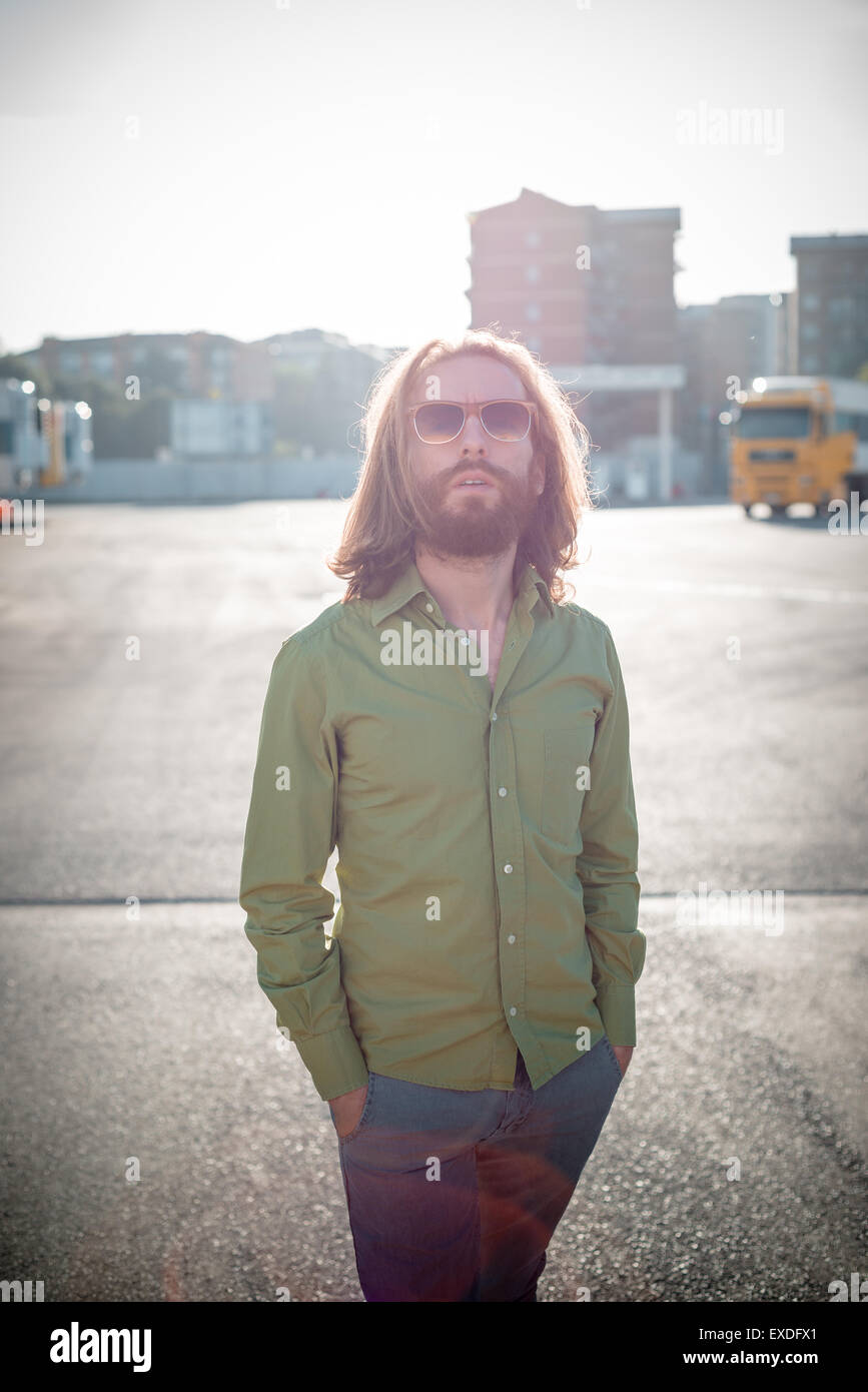 stylish hipster model with long red hair and beard lifestyle in the ...