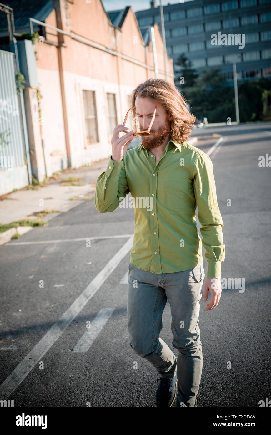 stylish hipster model with long red hair and beard lifestyle in the ...