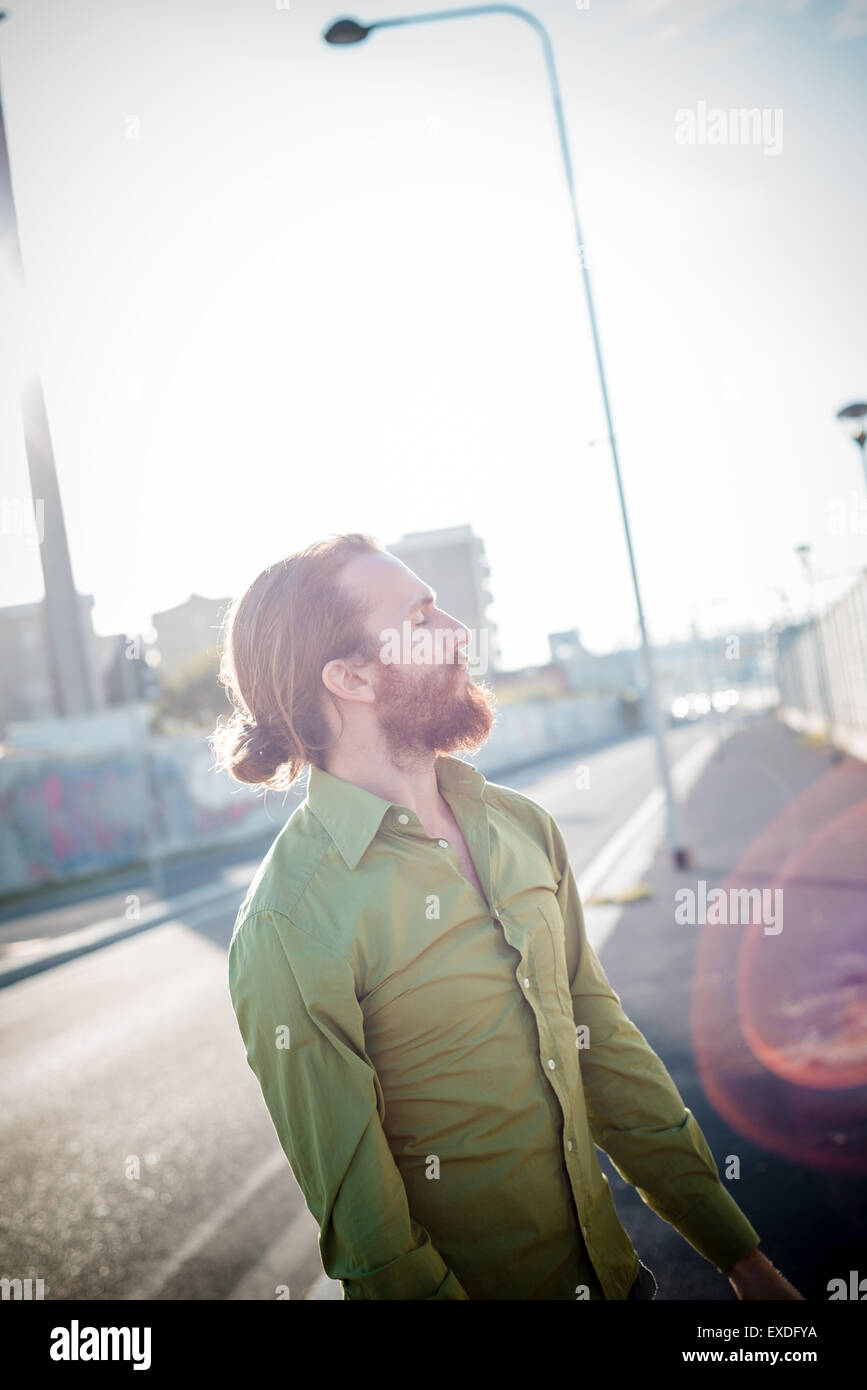 stylish hipster model with long red hair and beard lifestyle in the ...
