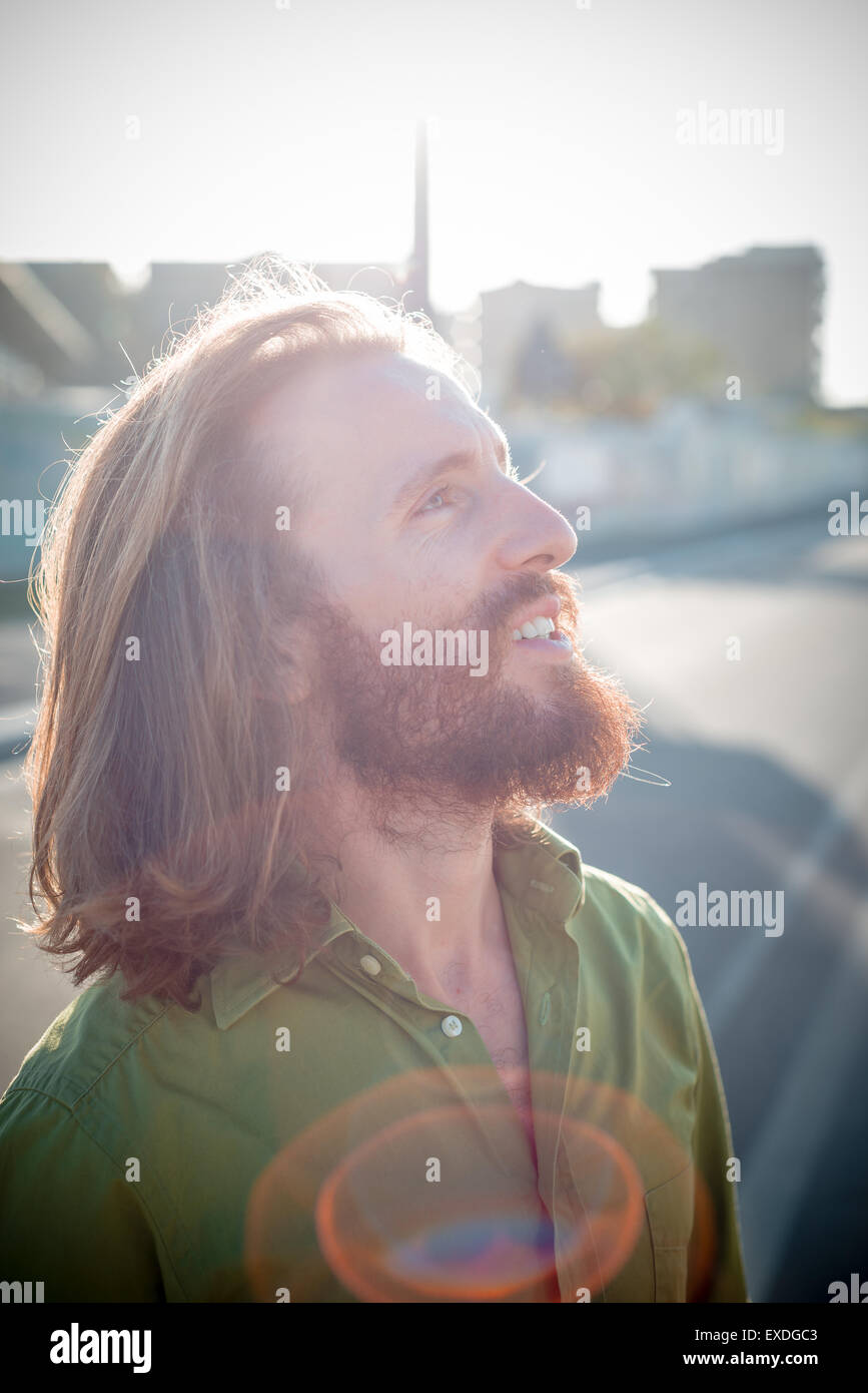 stylish hipster model with long red hair and beard lifestyle in the ...