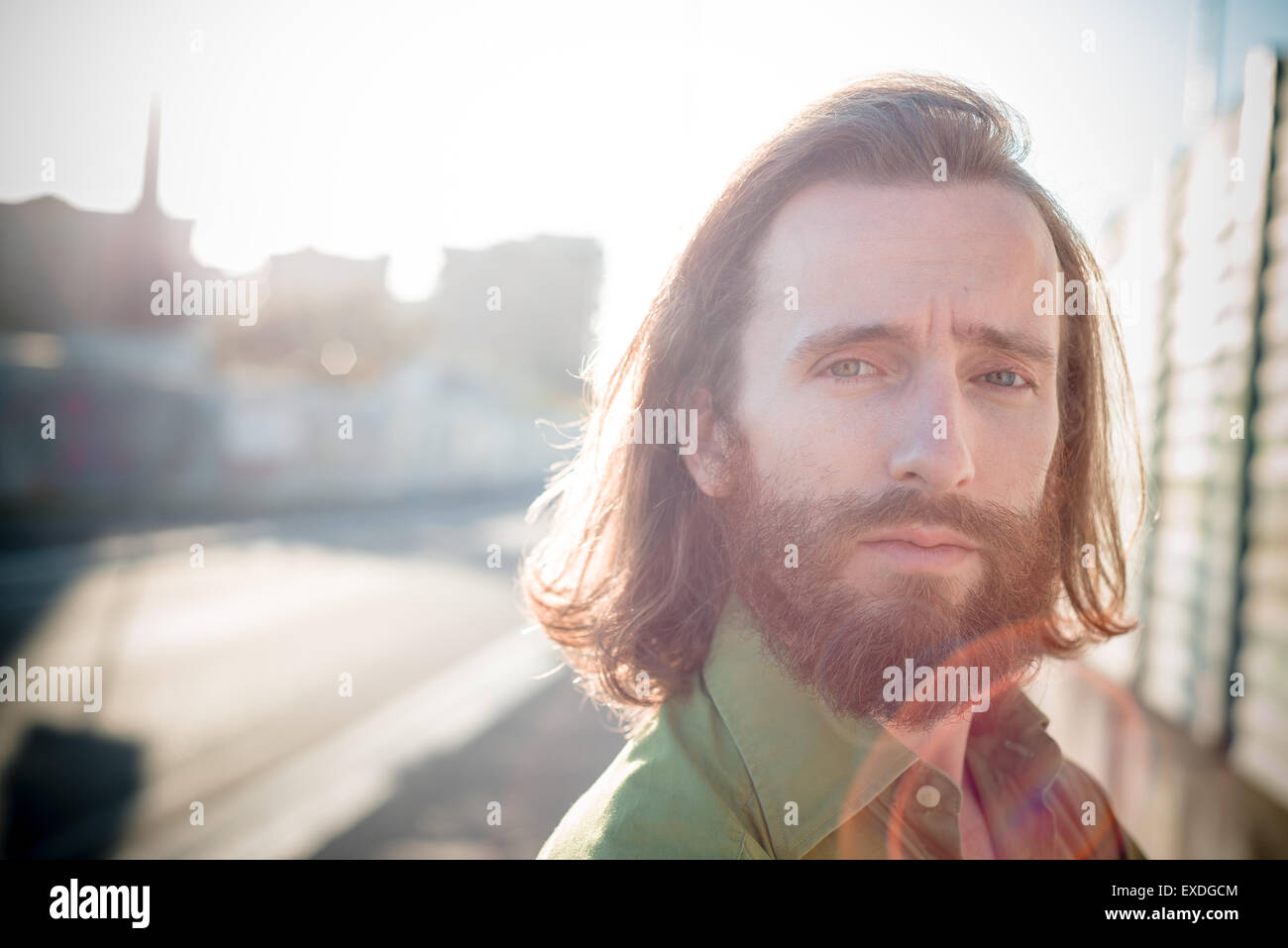stylish hipster model with long red hair and beard lifestyle in the ...
