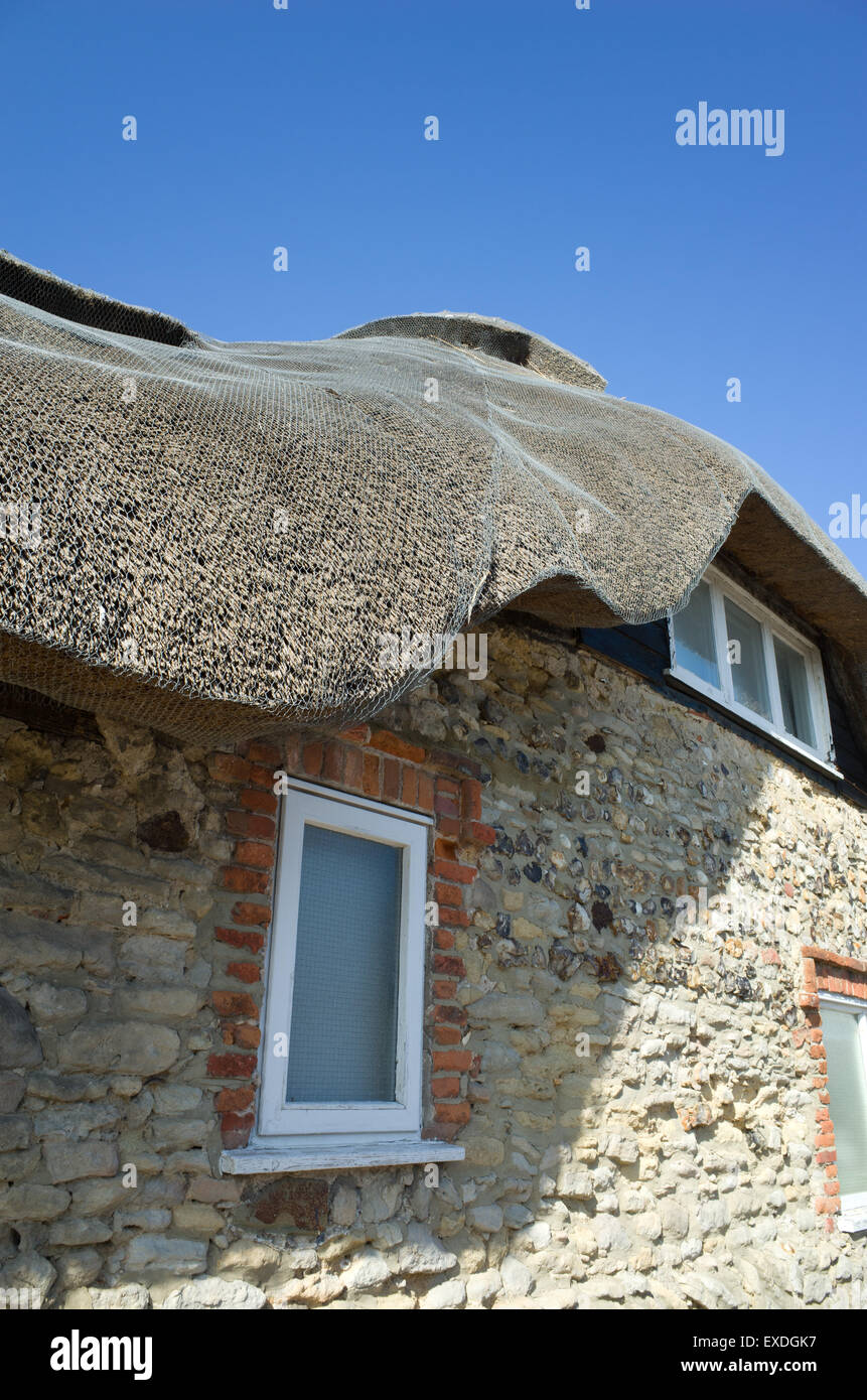 Traditional English stone cottage with thatched roof Stock Photo - Alamy