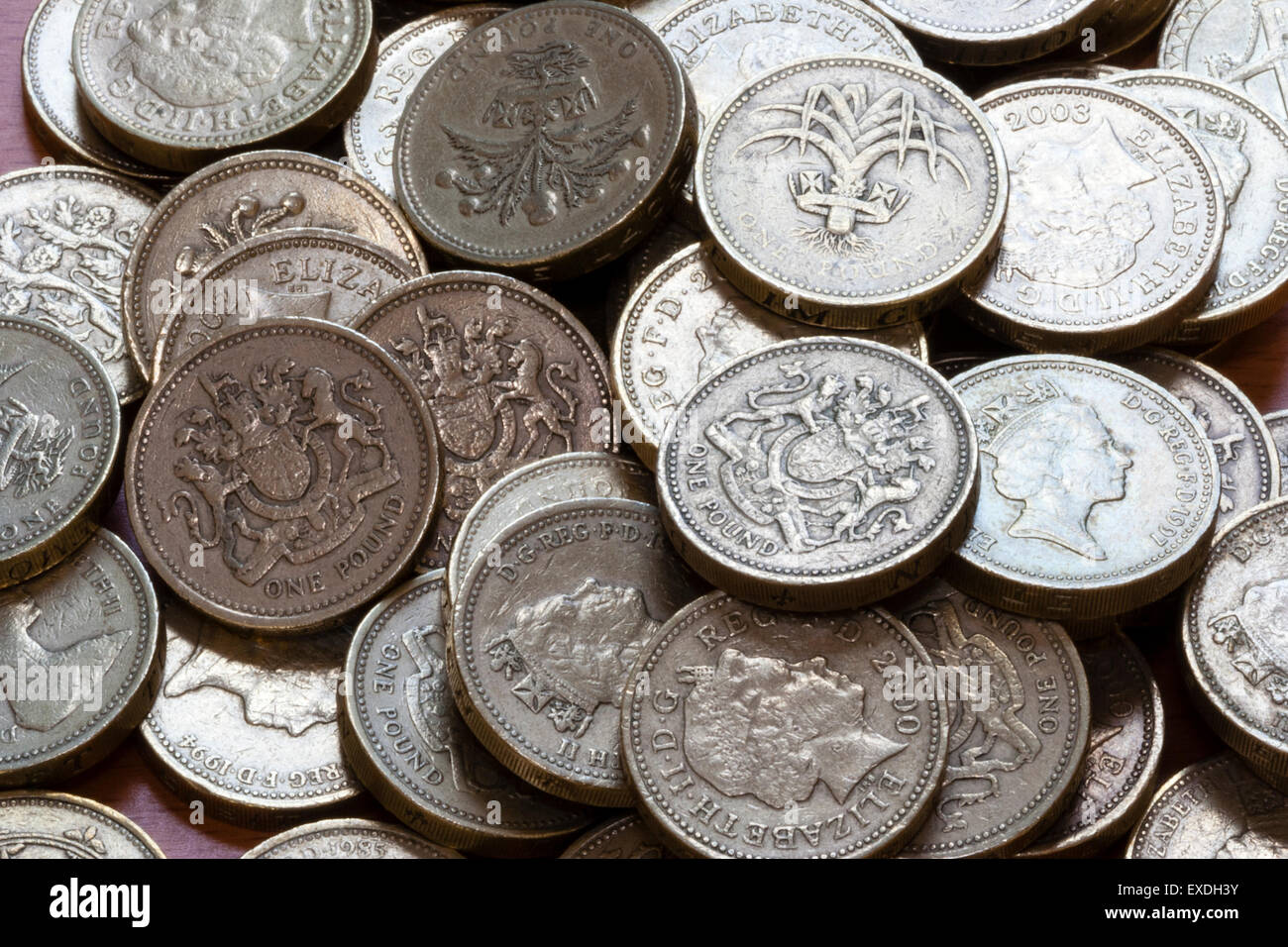 Pile of English one pound, £1 coins, pre 2016 type, scattered Stock ...