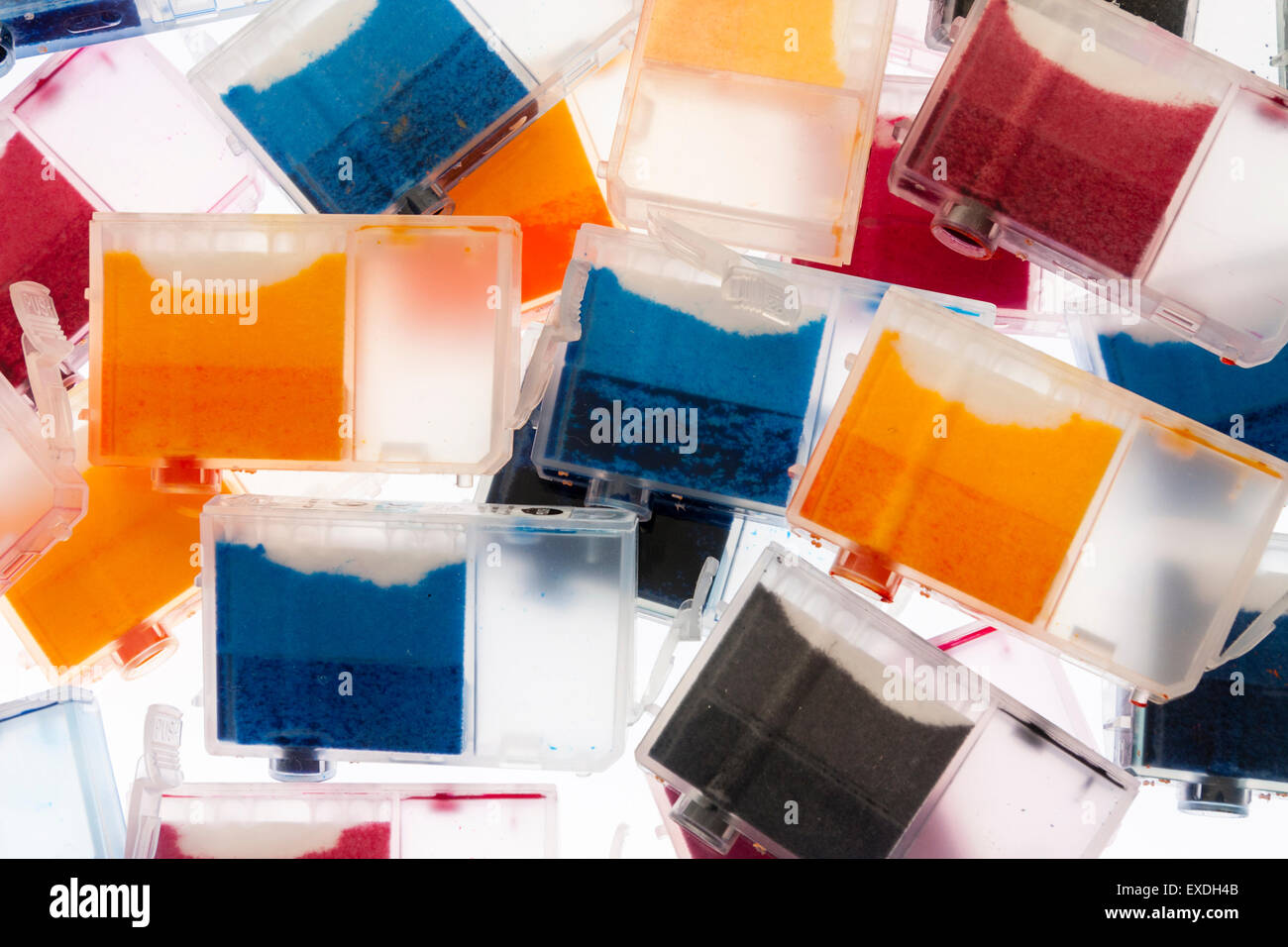 Scattered home printing empty used ink jet cartridges against back-lit ...