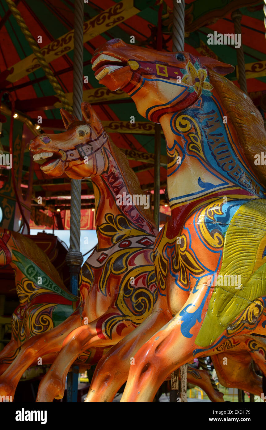 Galloping horses on a fairground merry go round Stock Photo - Alamy