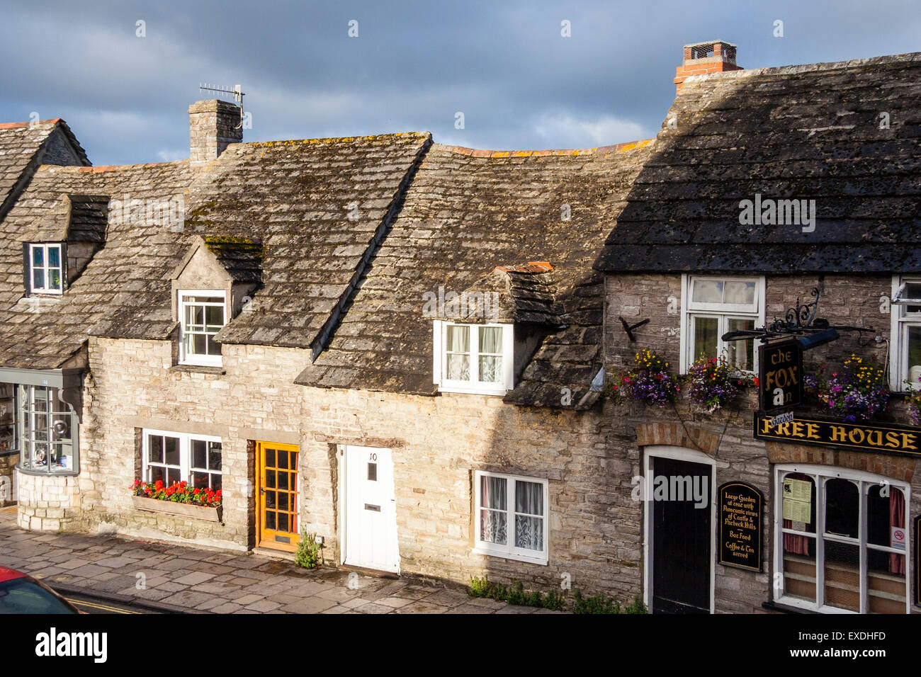 Typical English village scene. Picturesque terrace row of cottages made ...
