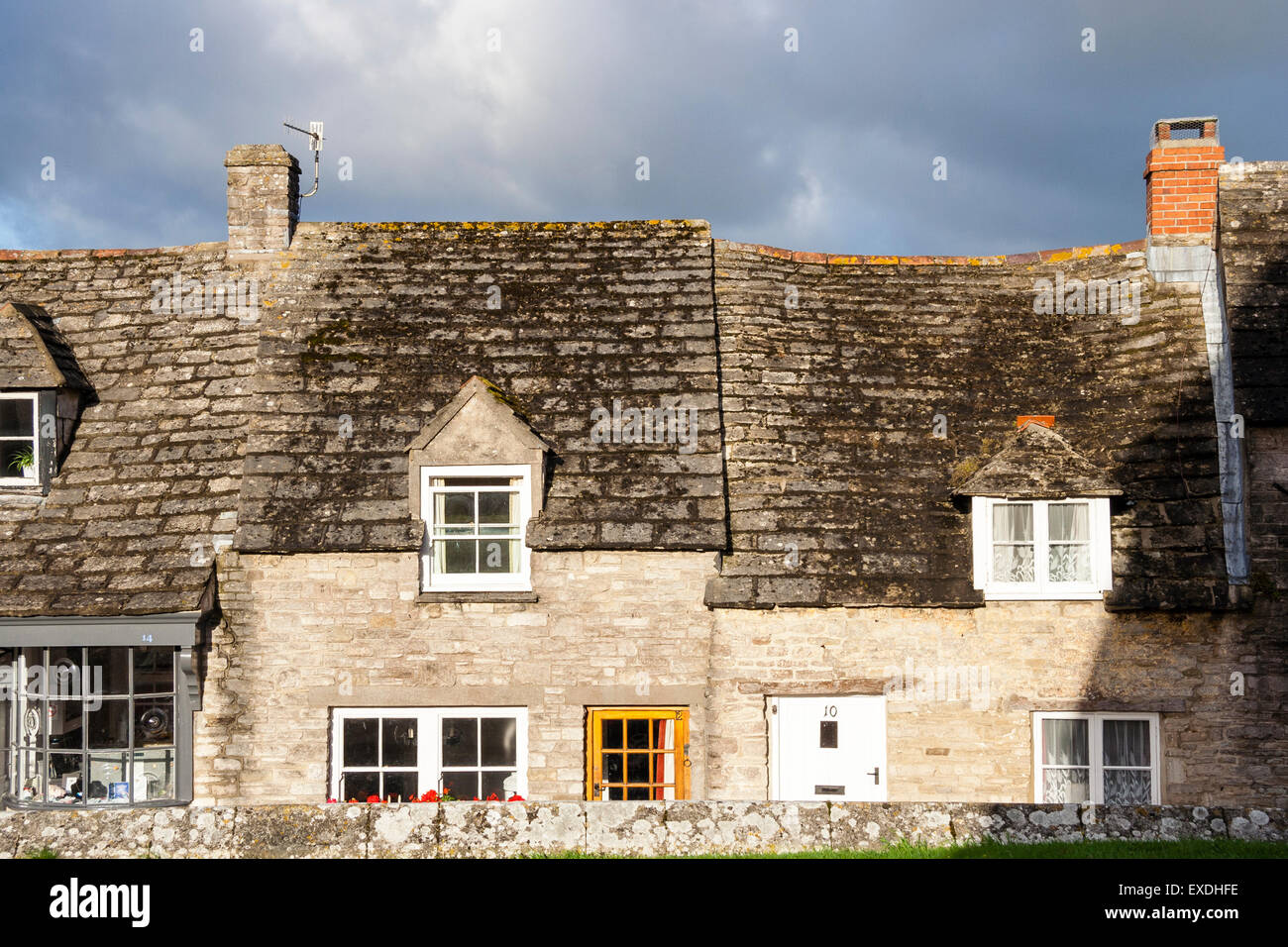 Typical English village scene. Picturesque terrace row of cottages made ...