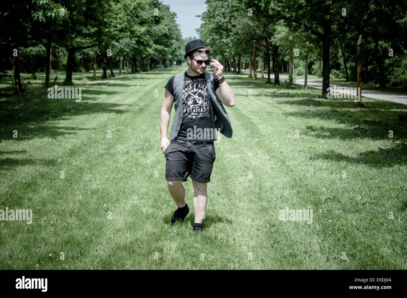 stylish man in the park in a sunny day Stock Photo - Alamy