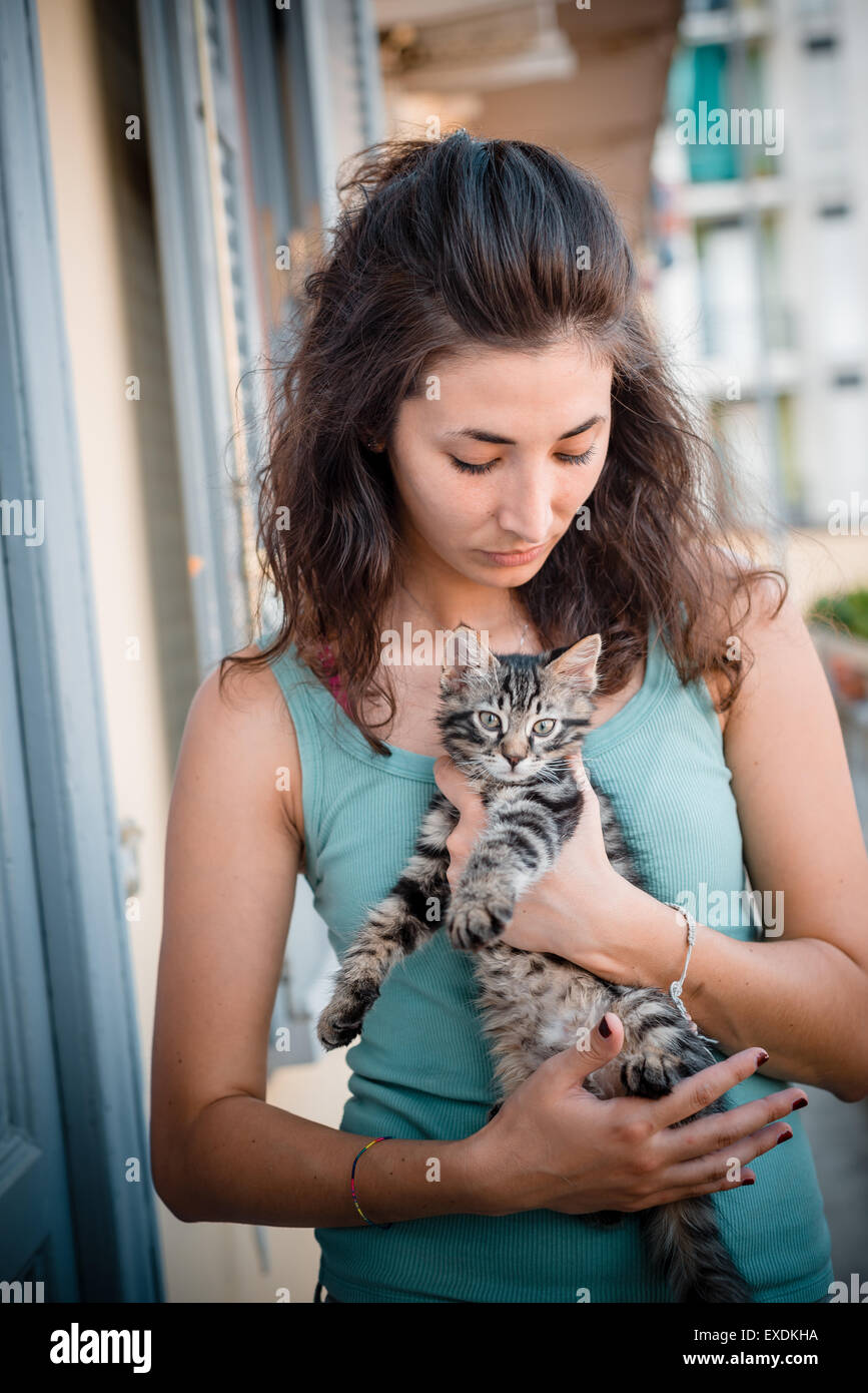 beautiful woman with cats at home Stock Photo - Alamy