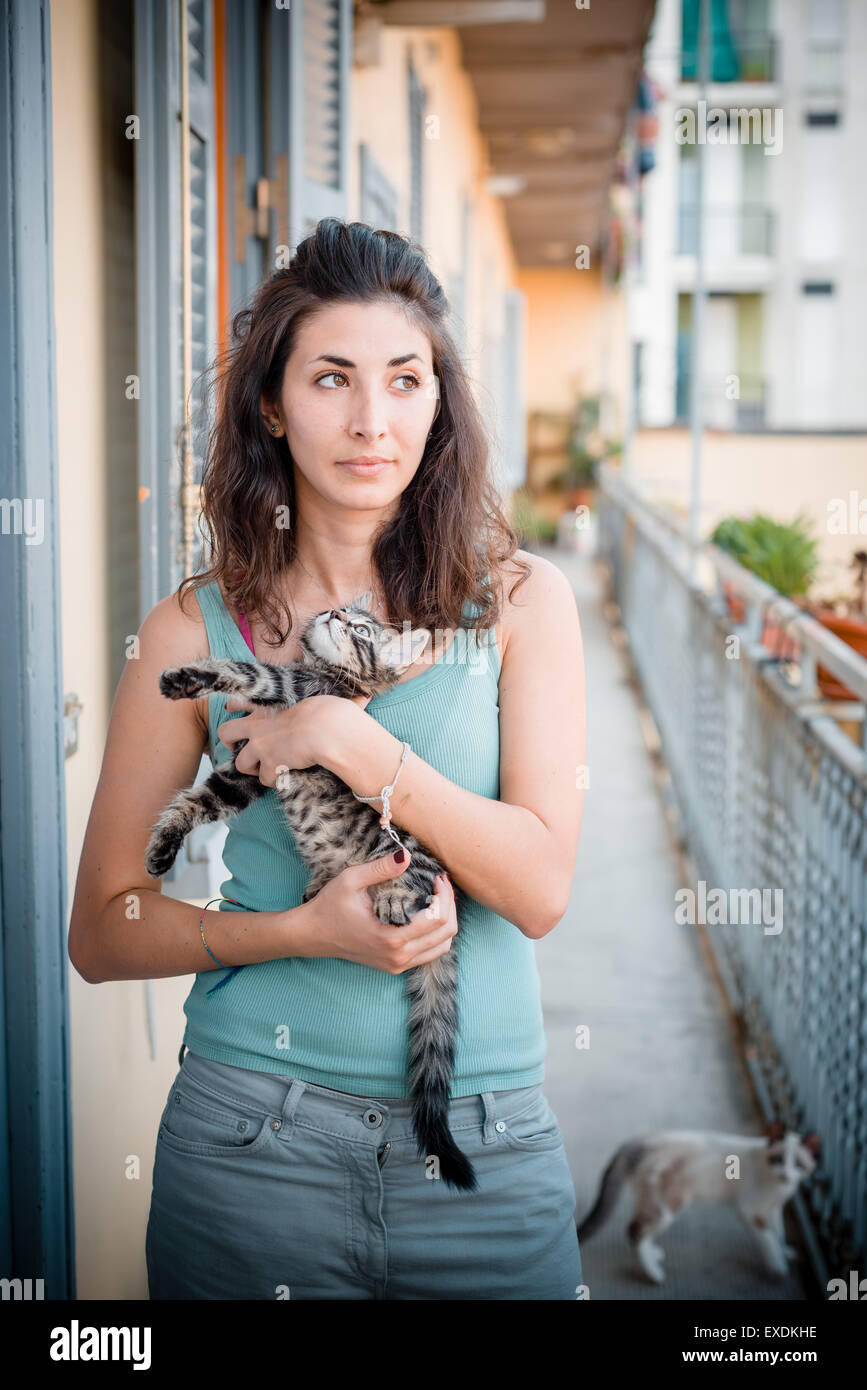 beautiful woman with cats at home Stock Photo - Alamy