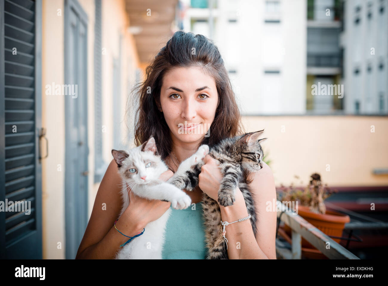 beautiful woman with cats at home Stock Photo - Alamy