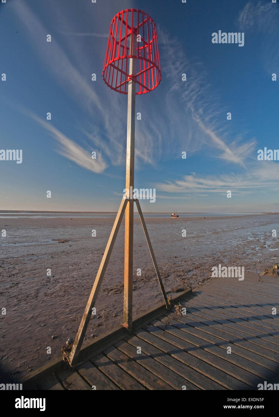 Red marker post at end of jetty on shoreline on River Ribble, Lytham ...