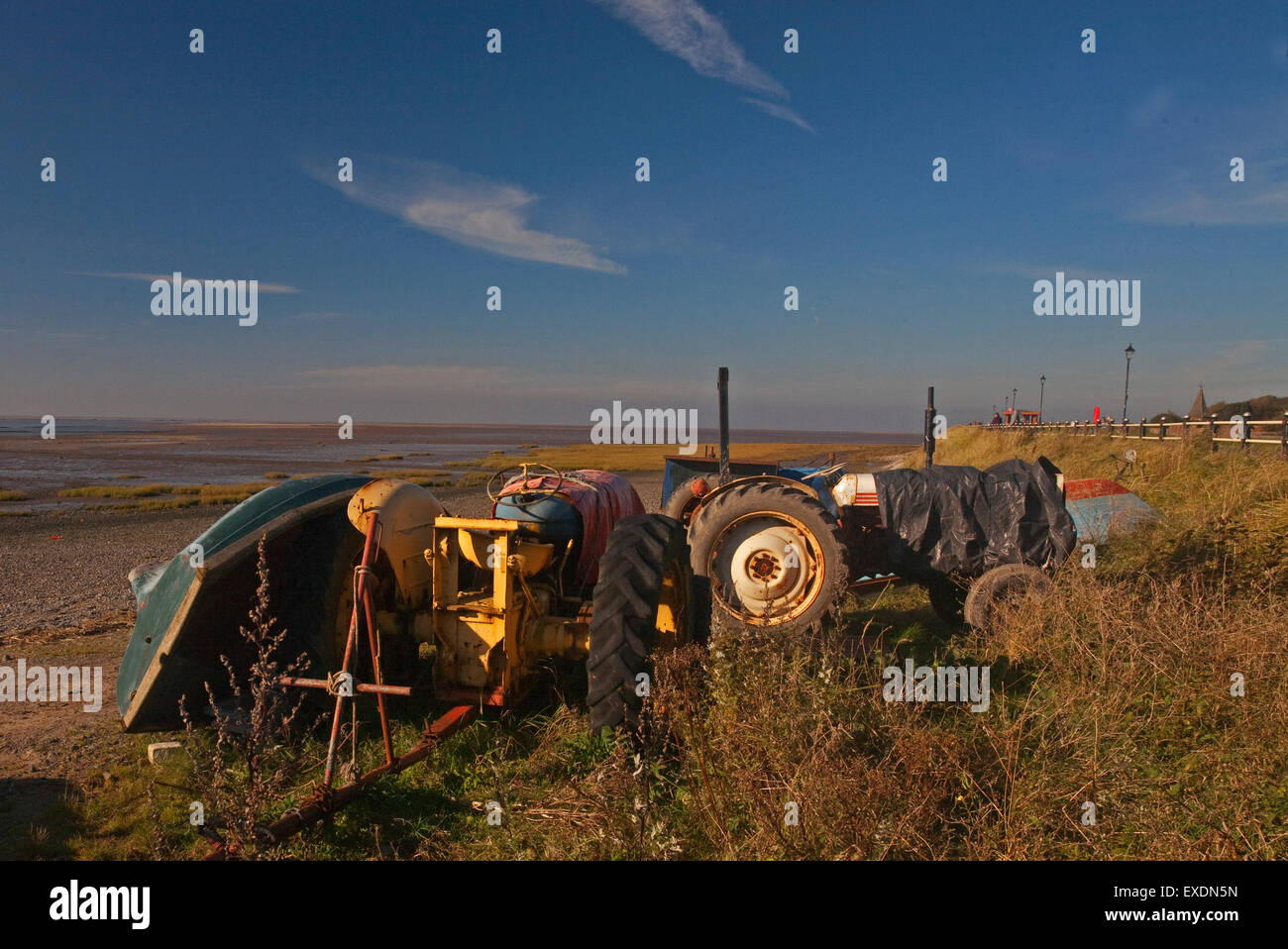 Old tractors used by shrimp fisherman on shoreline on River Ribble at ...