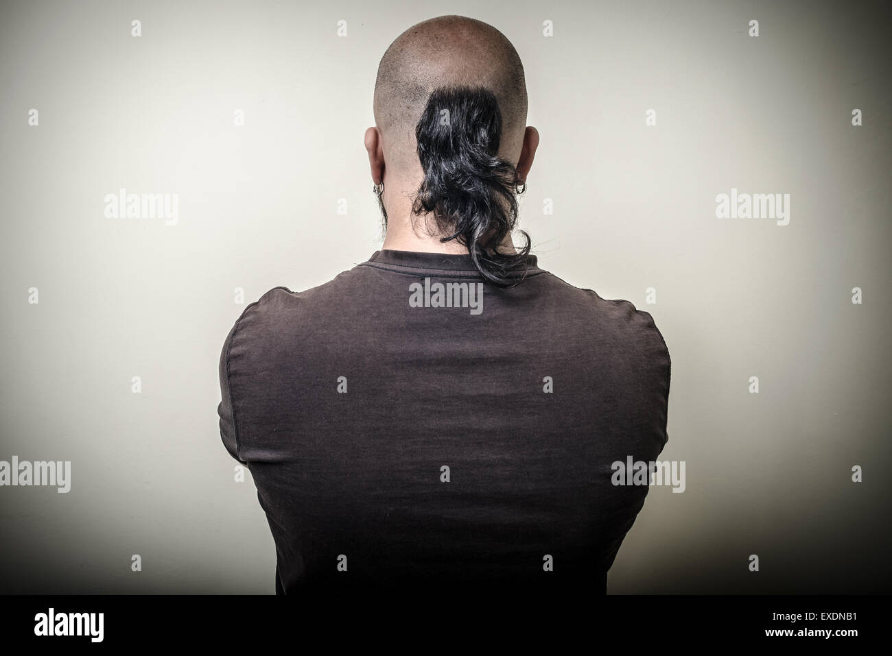 great back of a large person on gray background Stock Photo - Alamy