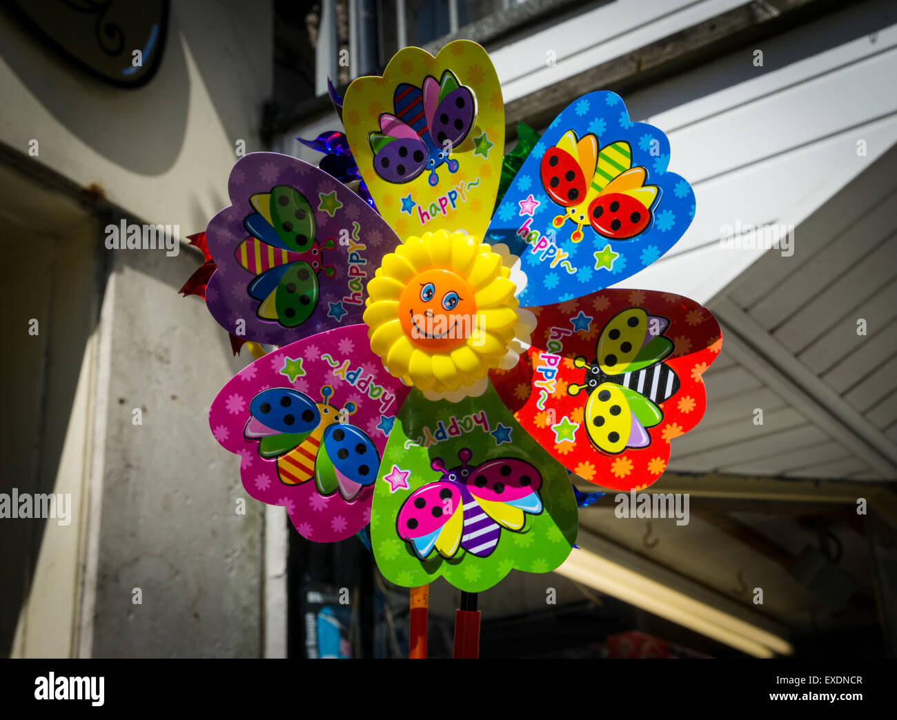 A smiley face on a wind toy Stock Photo - Alamy