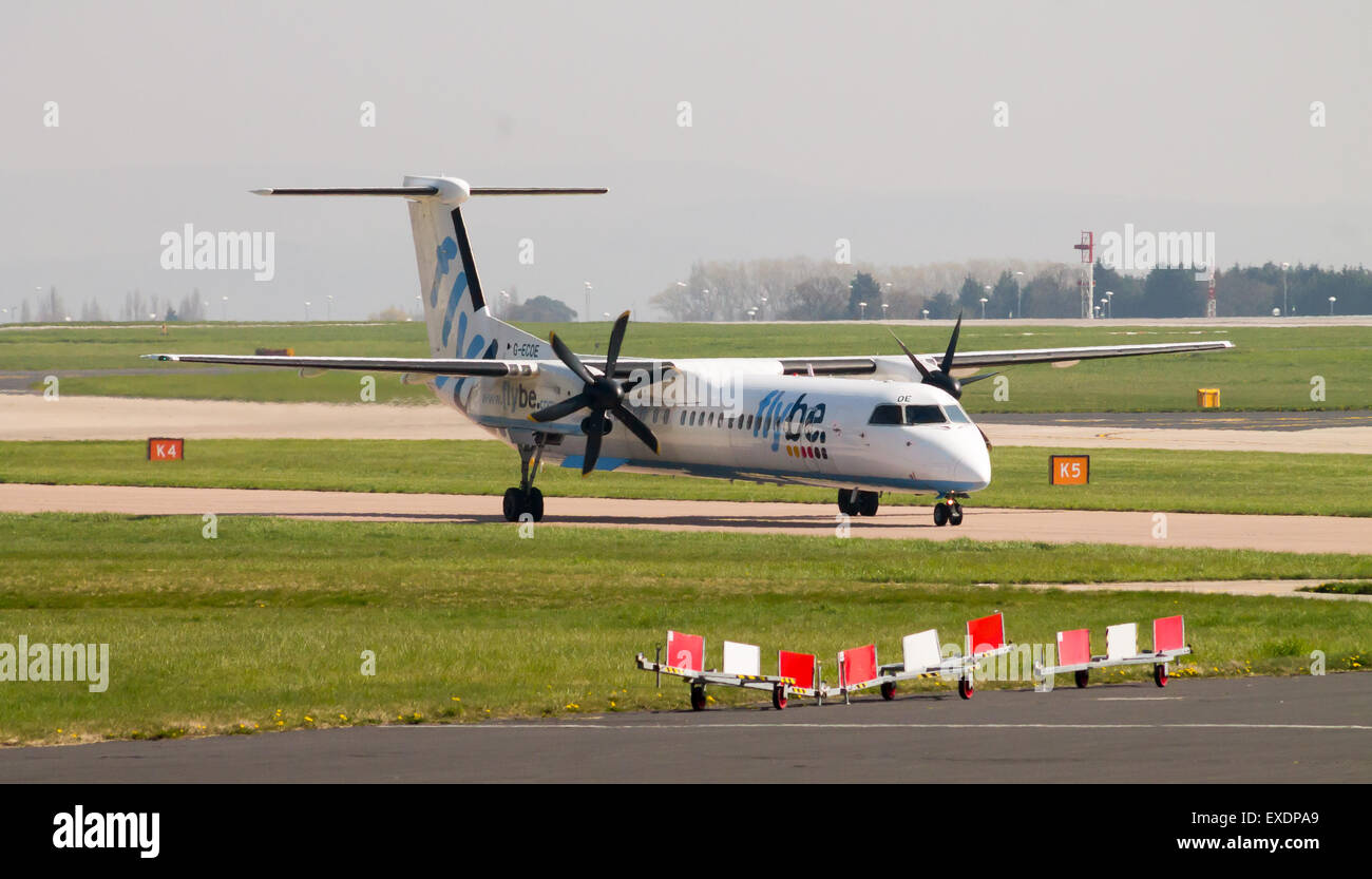 Flybe Bombardier Dash 8 taxiing on Manchester International Airport ...