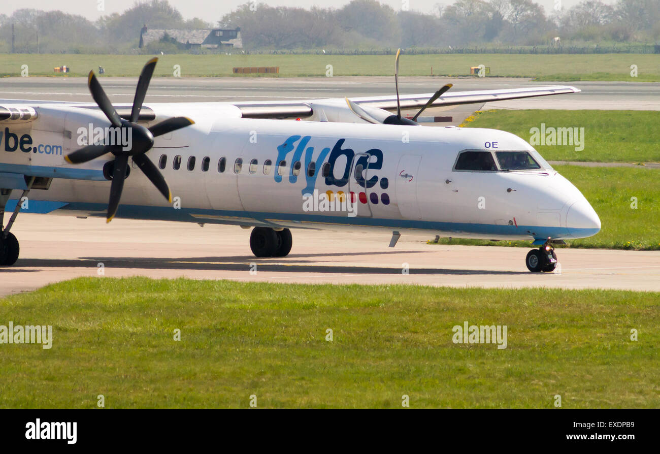 Flybe Bombardier Dash 8 taxiing on Manchester International Airport ...