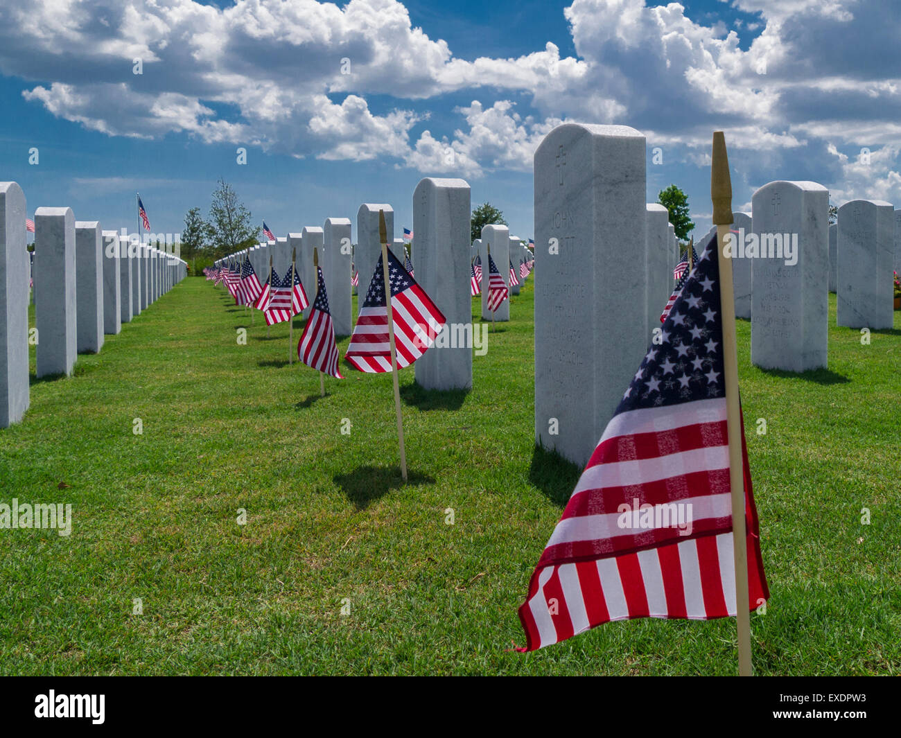 Rows of grave stones and American flags in Sarasota National Cemetery ...