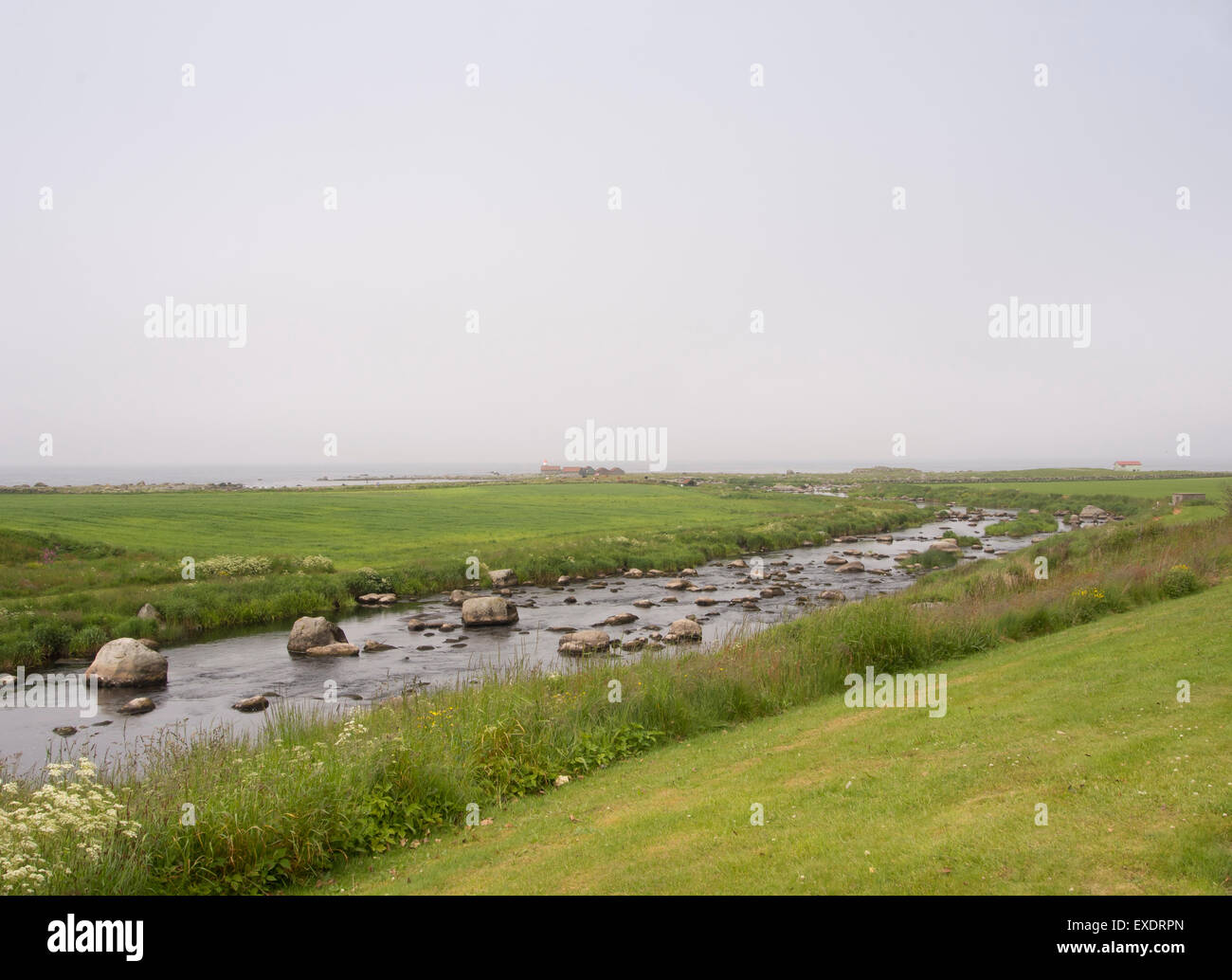 river Haa (Hå) meets the North Sea, flat agricultural landscape, fog ...