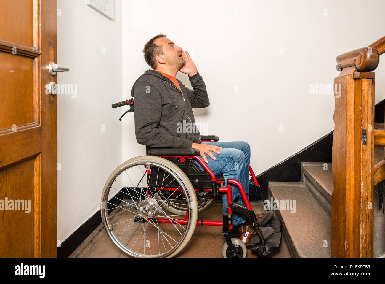 man in wheelchair facing a barrier of stairs Stock Photo - Alamy