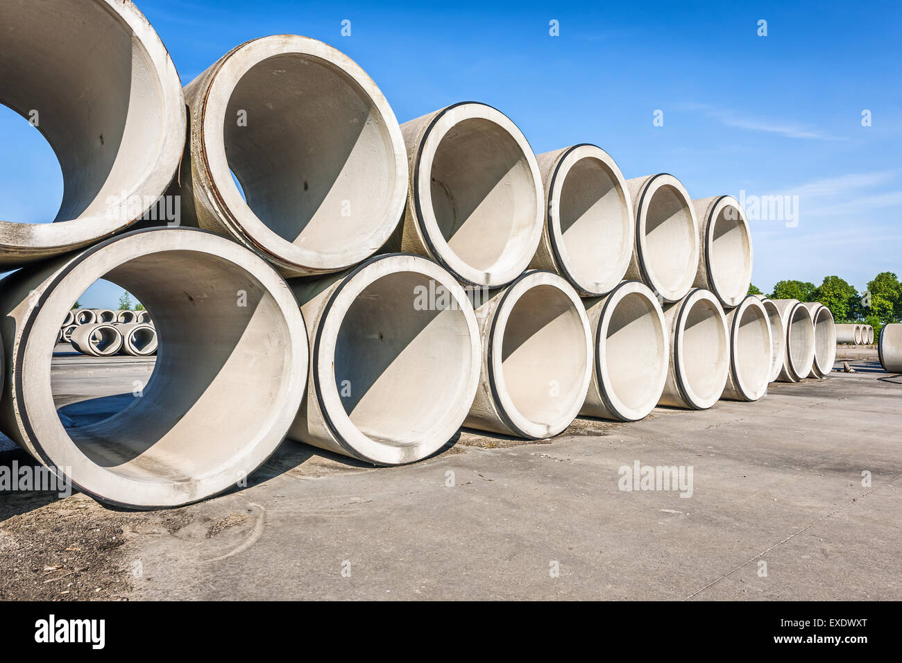 Big concrete sewage pipes stored in a factory Stock Photo - Alamy