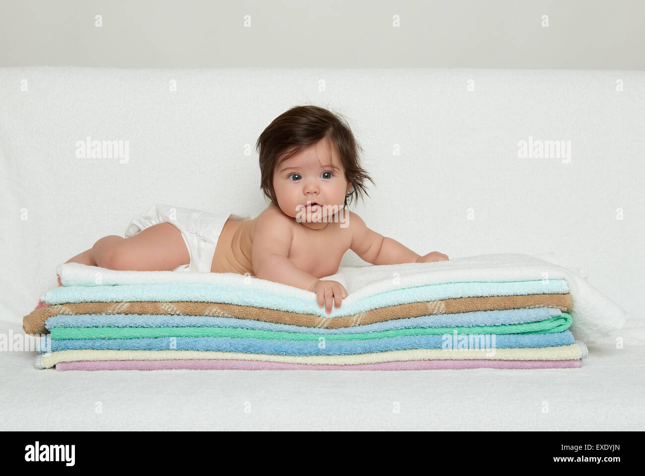 one happy baby on towel Stock Photo - Alamy