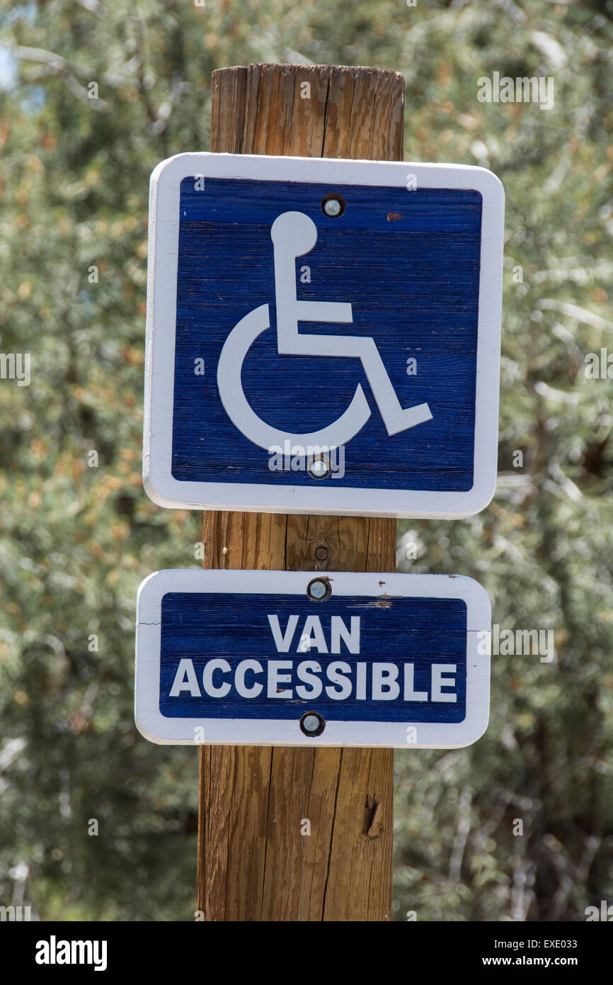 A sign showing a parking space if van accessible for physically ...