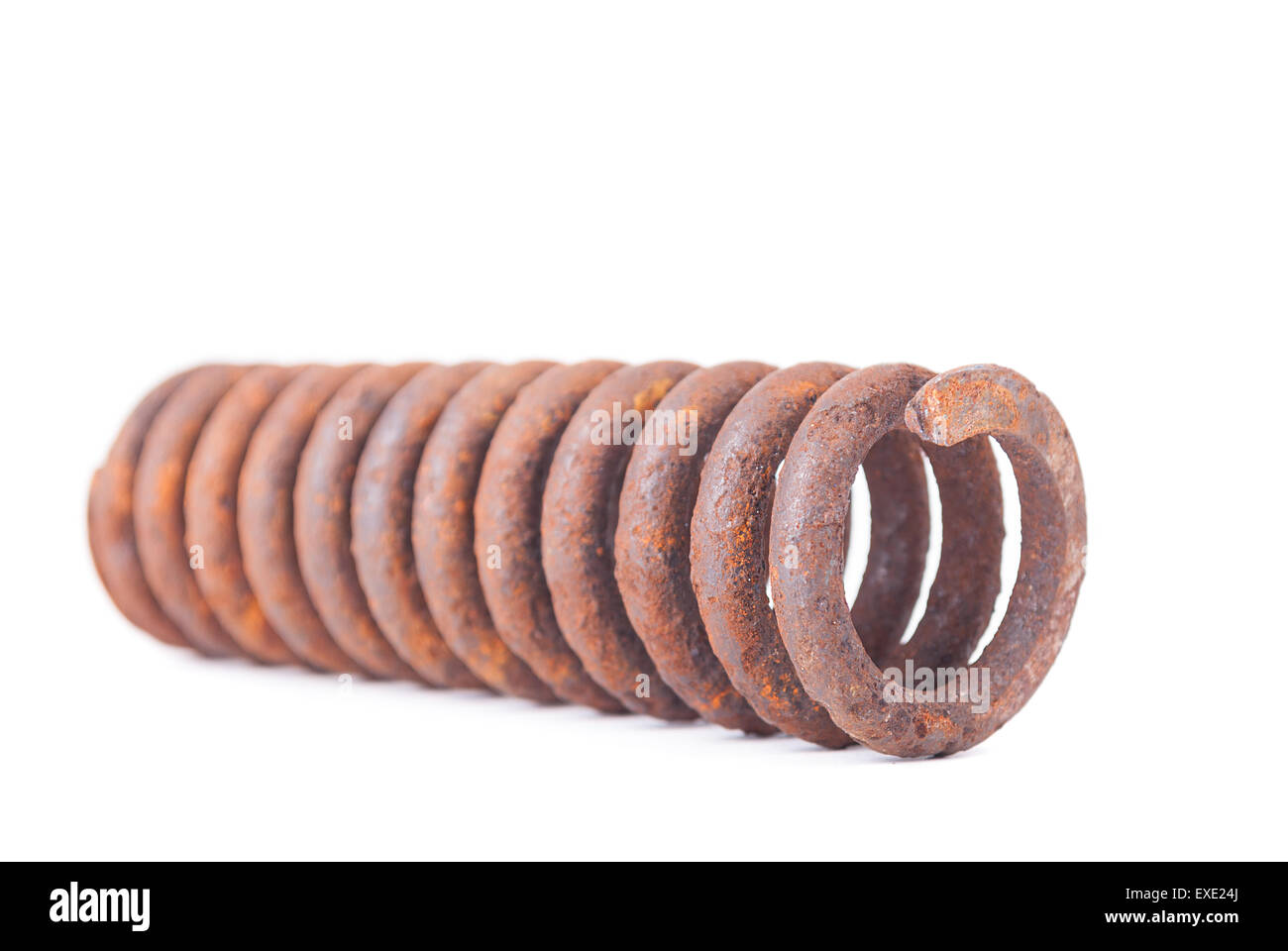 Old rusty metallic spring on white background Stock Photo - Alamy