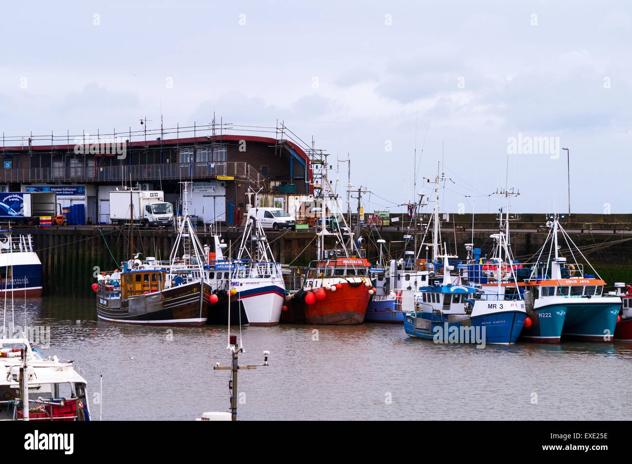 Colourful fishing boats tied up at Bridlington Harbour, East Riding of ...