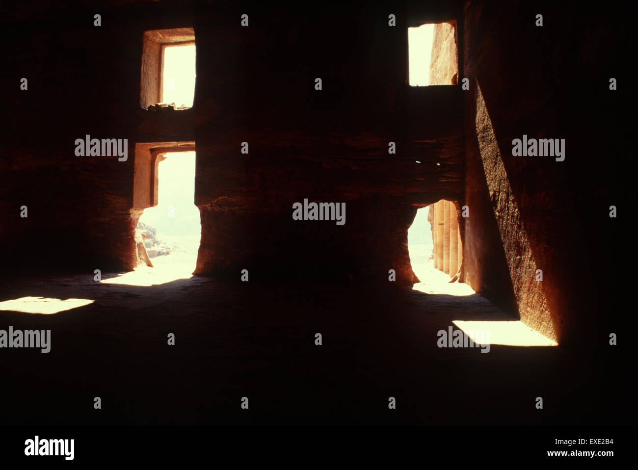 Shafts of light shine through window and door openings of the Urn Tomb ...