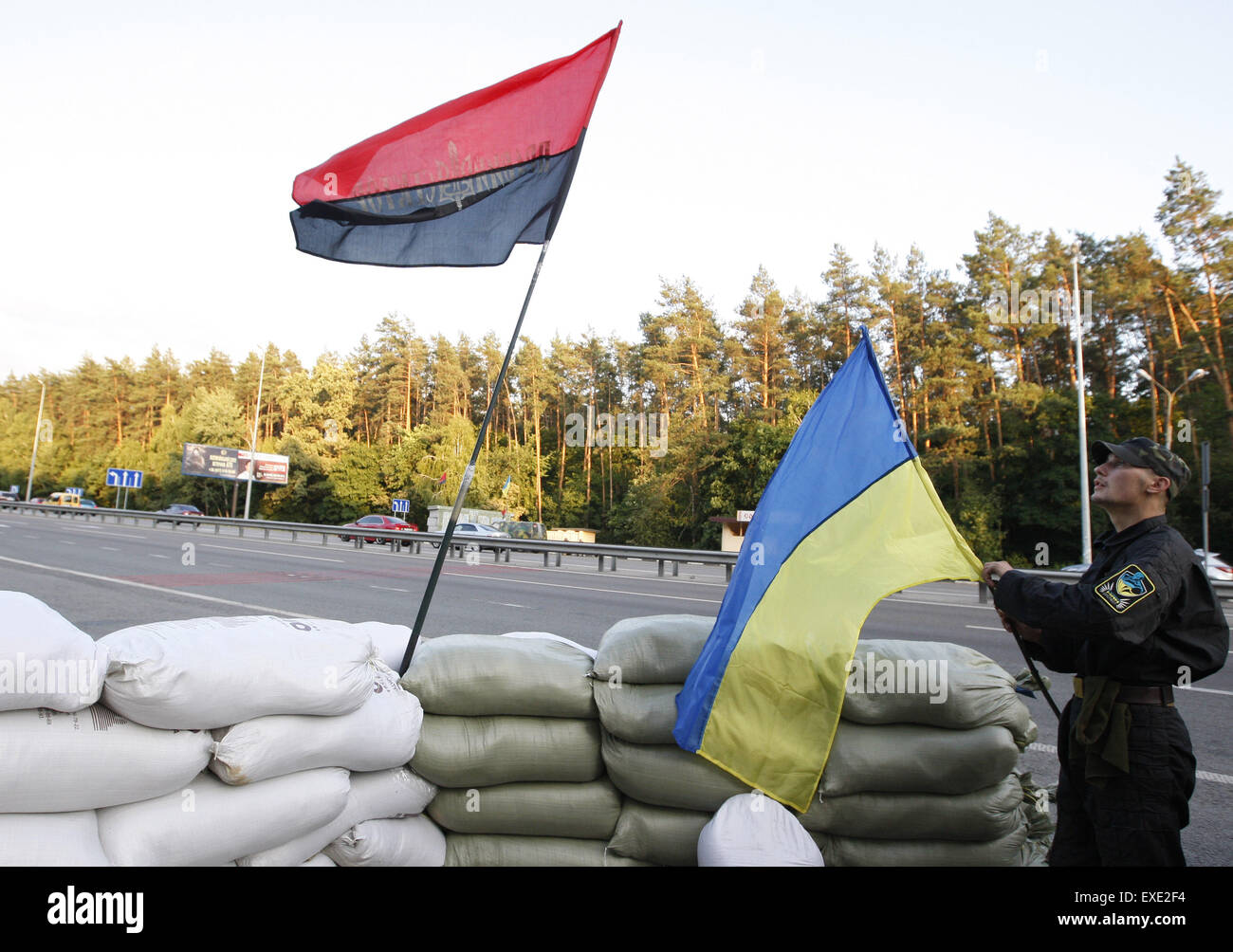 Kiev, Ukraine. 12th July, 2015. Member of Right Sector party stand with ...
